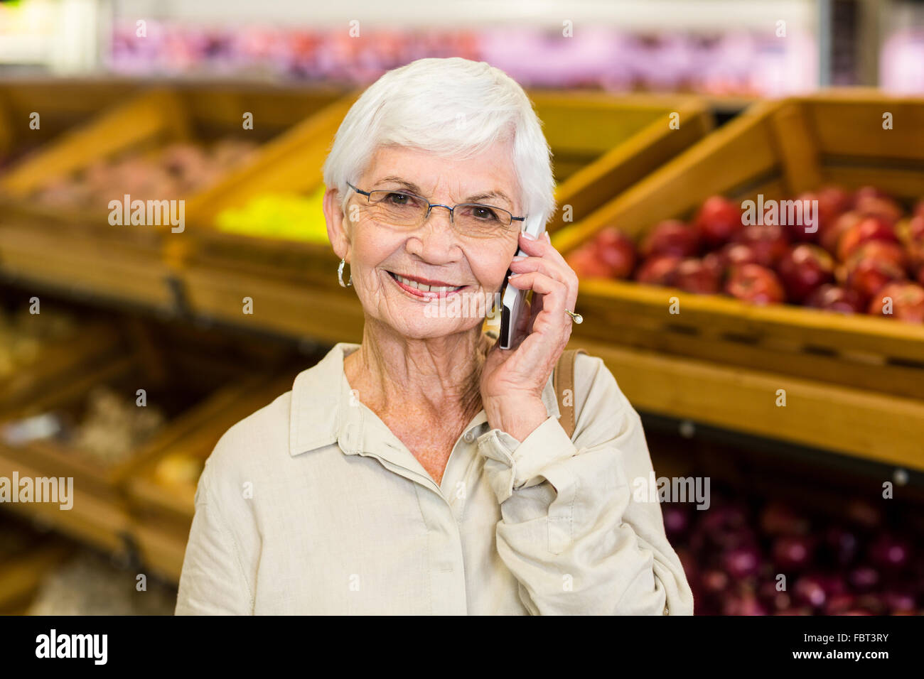 Old woman having a phone call Stock Photo - Alamy