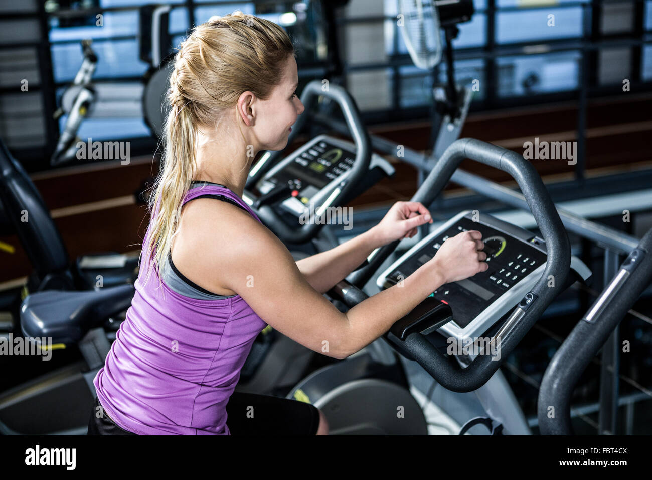 Rear view of woman doing bike exercise Stock Photo - Alamy