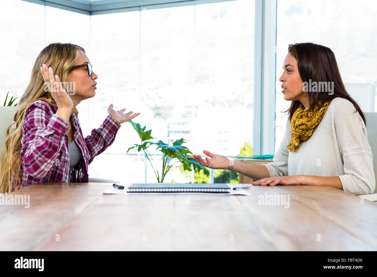 Two girls work at office Stock Photo - Alamy