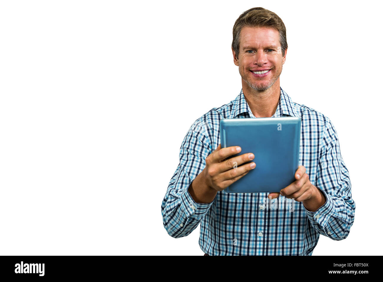 Portrait of happy man using tablet Stock Photo - Alamy