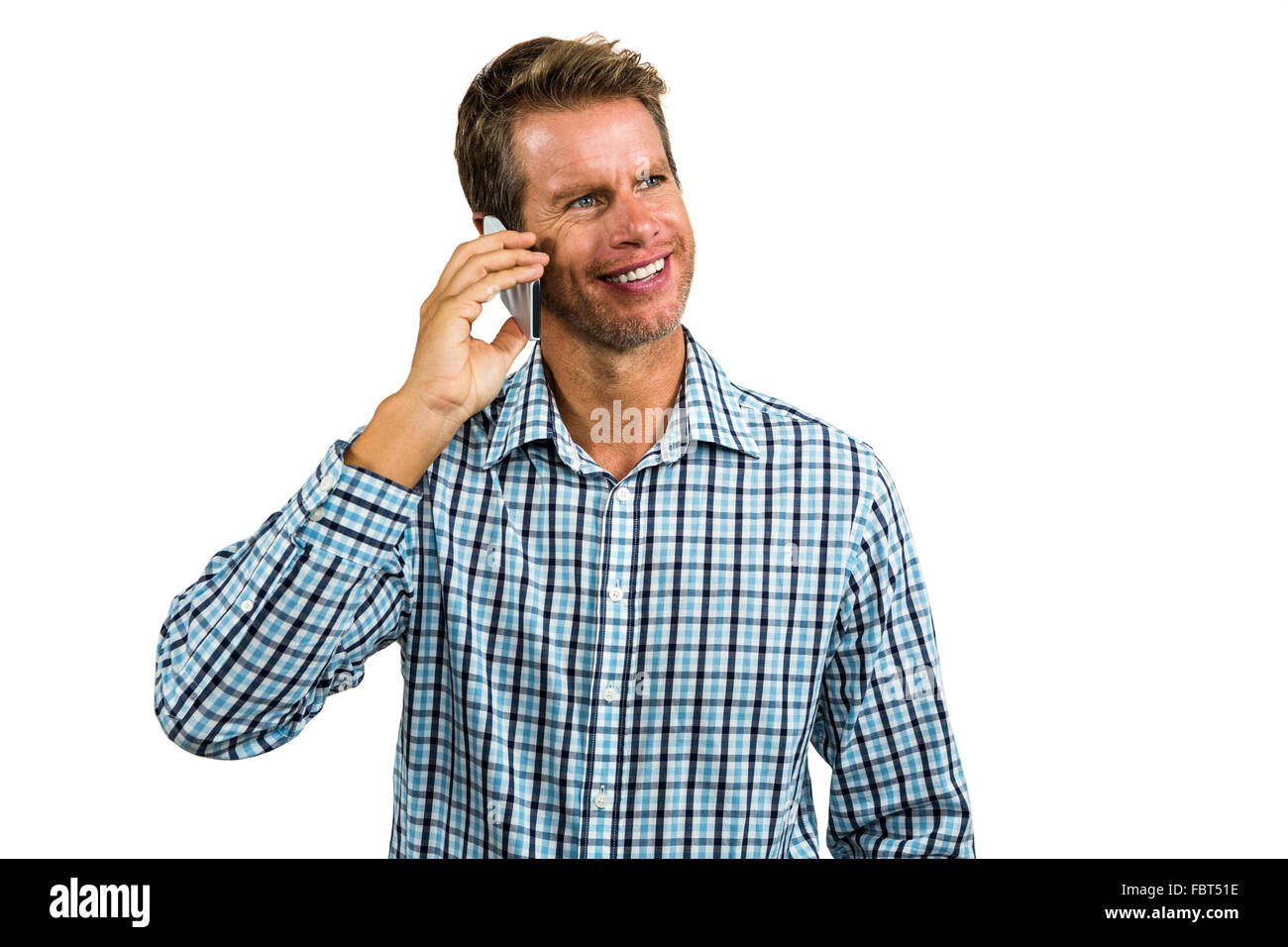 Smiling man talking on smartphone Stock Photo - Alamy