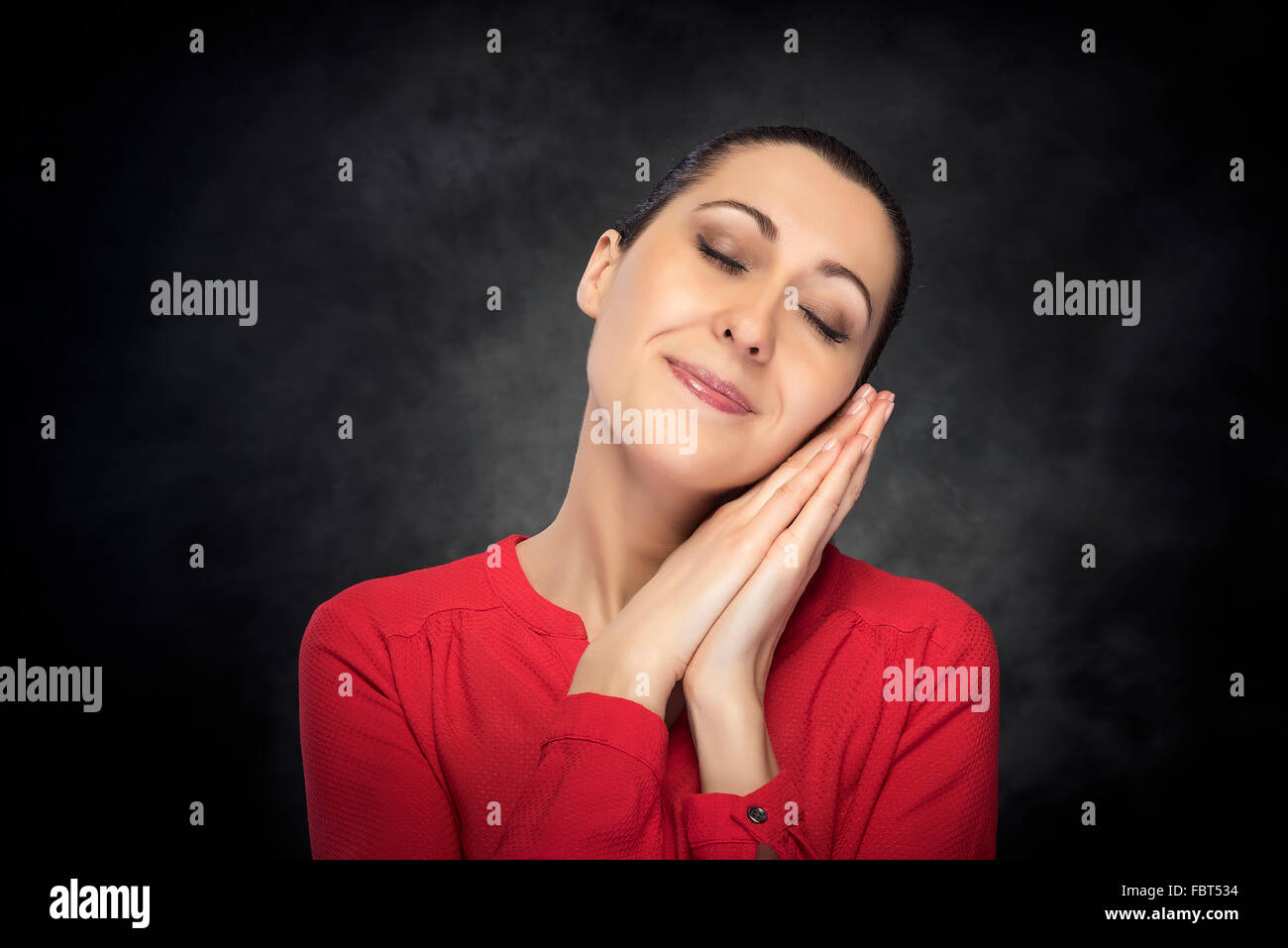 Woman sleeping on hands Stock Photo - Alamy