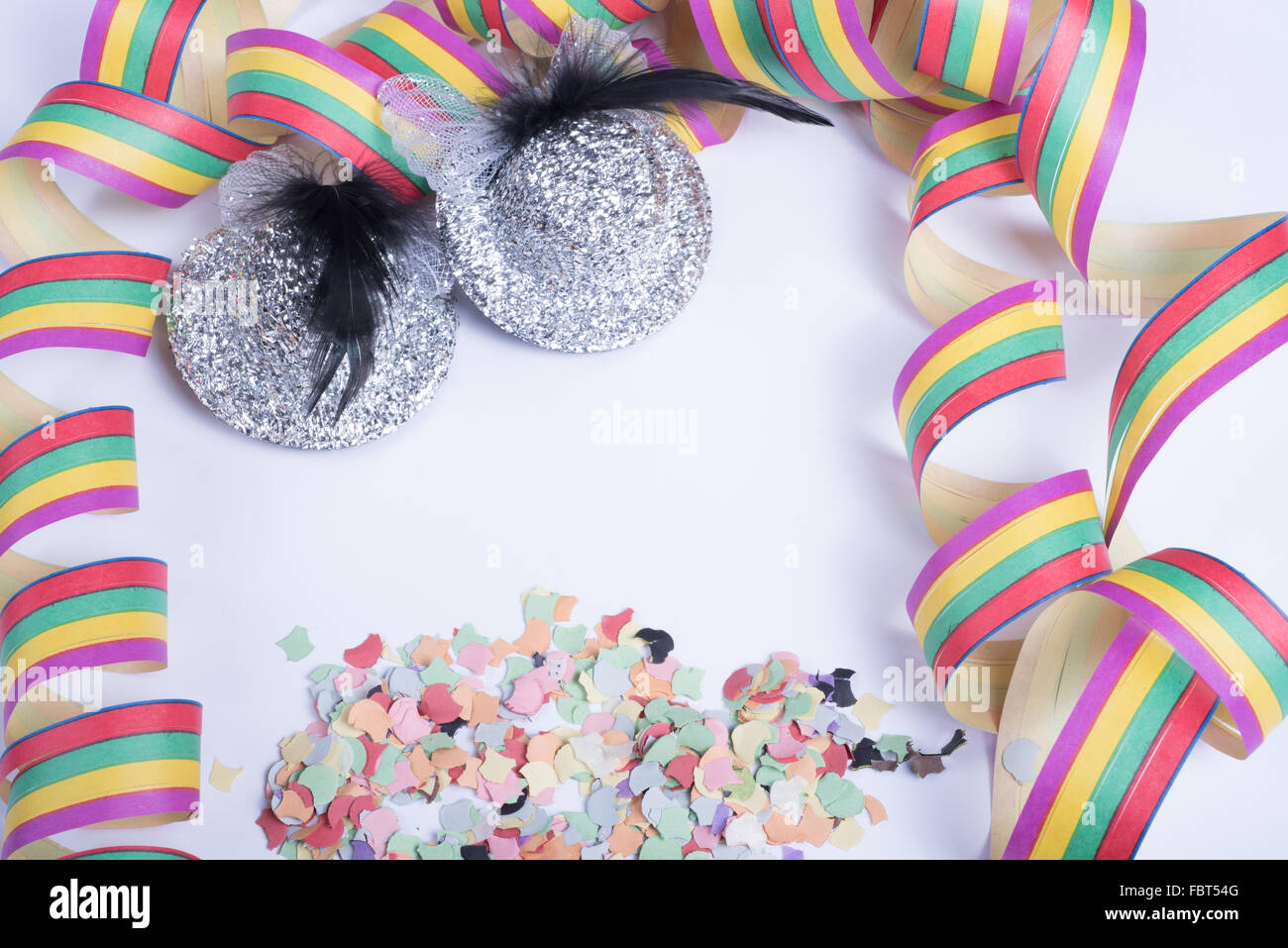 streamers with two glittering carnival heads on white Stock Photo - Alamy