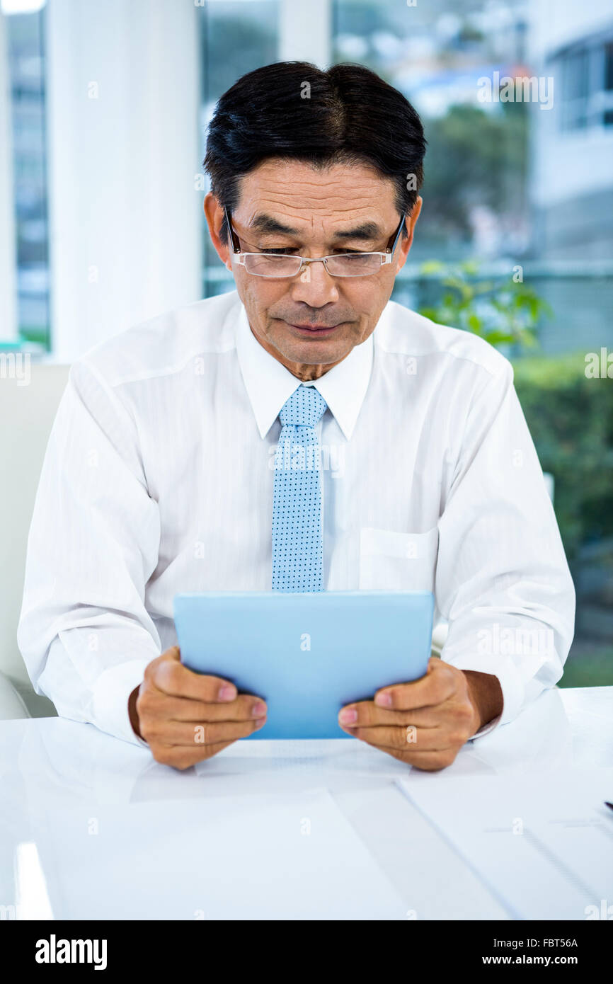 Serious senior businessman using pc hi-res stock photography and images ...