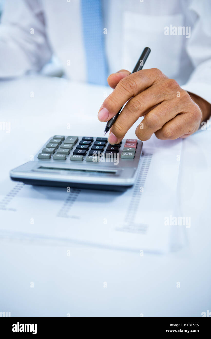 Elderly business man calculator hi-res stock photography and images - Alamy