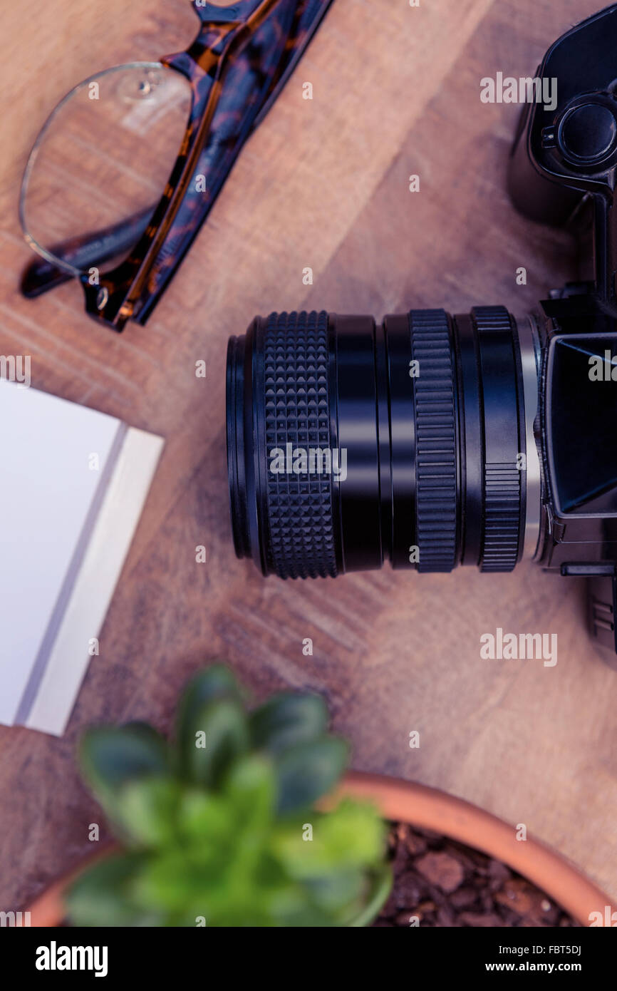 Photo camera on office table with notepad hi-res stock photography and ...
