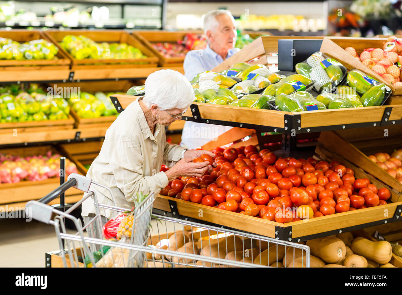 Senior couple buying food at the grocery Stock Photo - Alamy