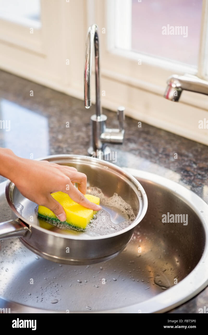 Pretty young woman washing up hi-res stock photography and images - Alamy