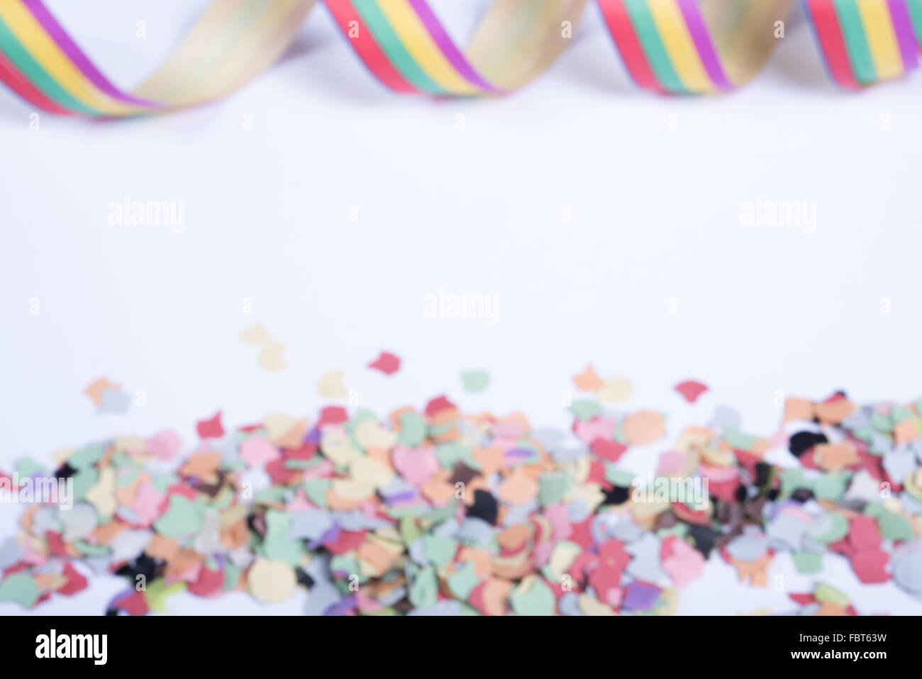 blurred confetti and streamers on white background Stock Photo - Alamy