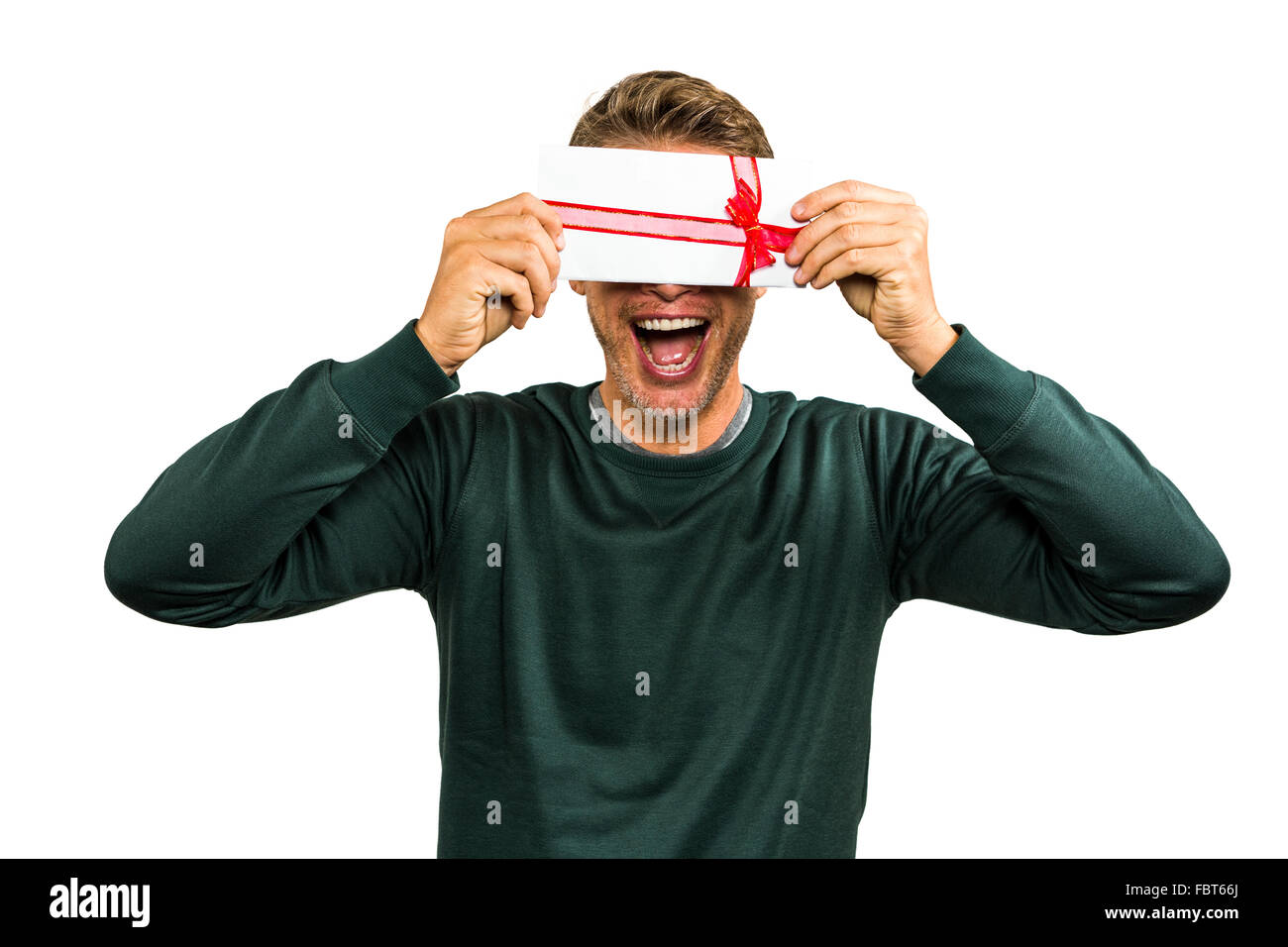 Cheerful man hiding face with gift Stock Photo - Alamy