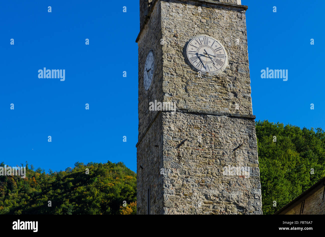 ancient stone tower with clock Stock Photo - Alamy