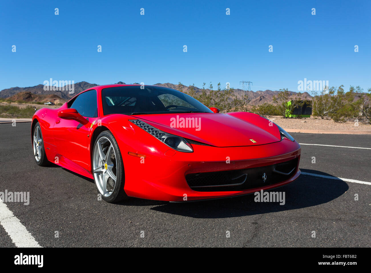 Ferrari 458 Italia in desert with mountains in background Stock Photo ...