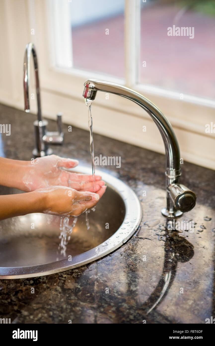 Mid section of woman washing hands Stock Photo - Alamy