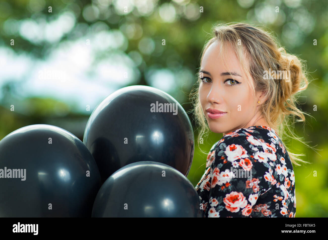 Beautiful hispanic model wearing summer dress posing for camera with ...