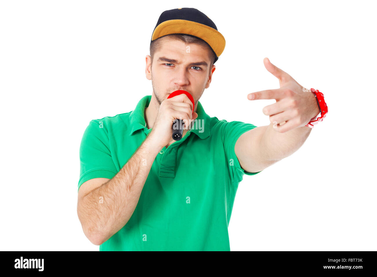 Portrait of young male hip hopper singing in studio isolated on white ...