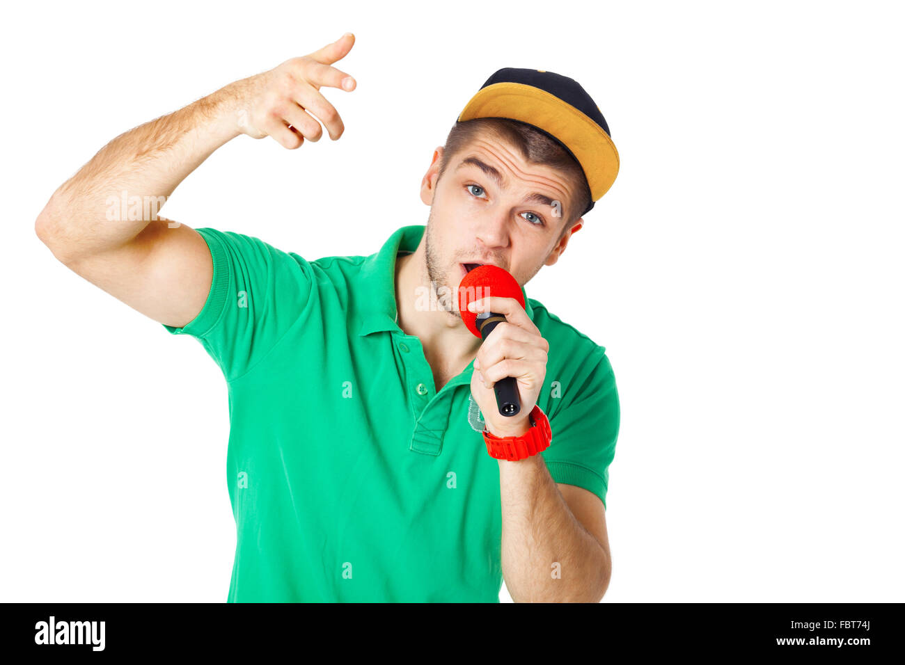 Portrait of young male hip hopper singing in studio isolated on white ...
