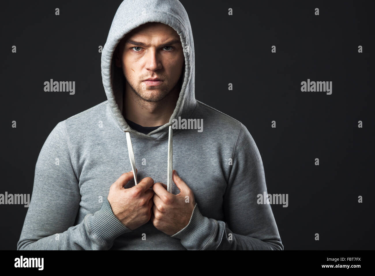 Studio portrait of brutal looking young guy in sportswear Stock Photo ...