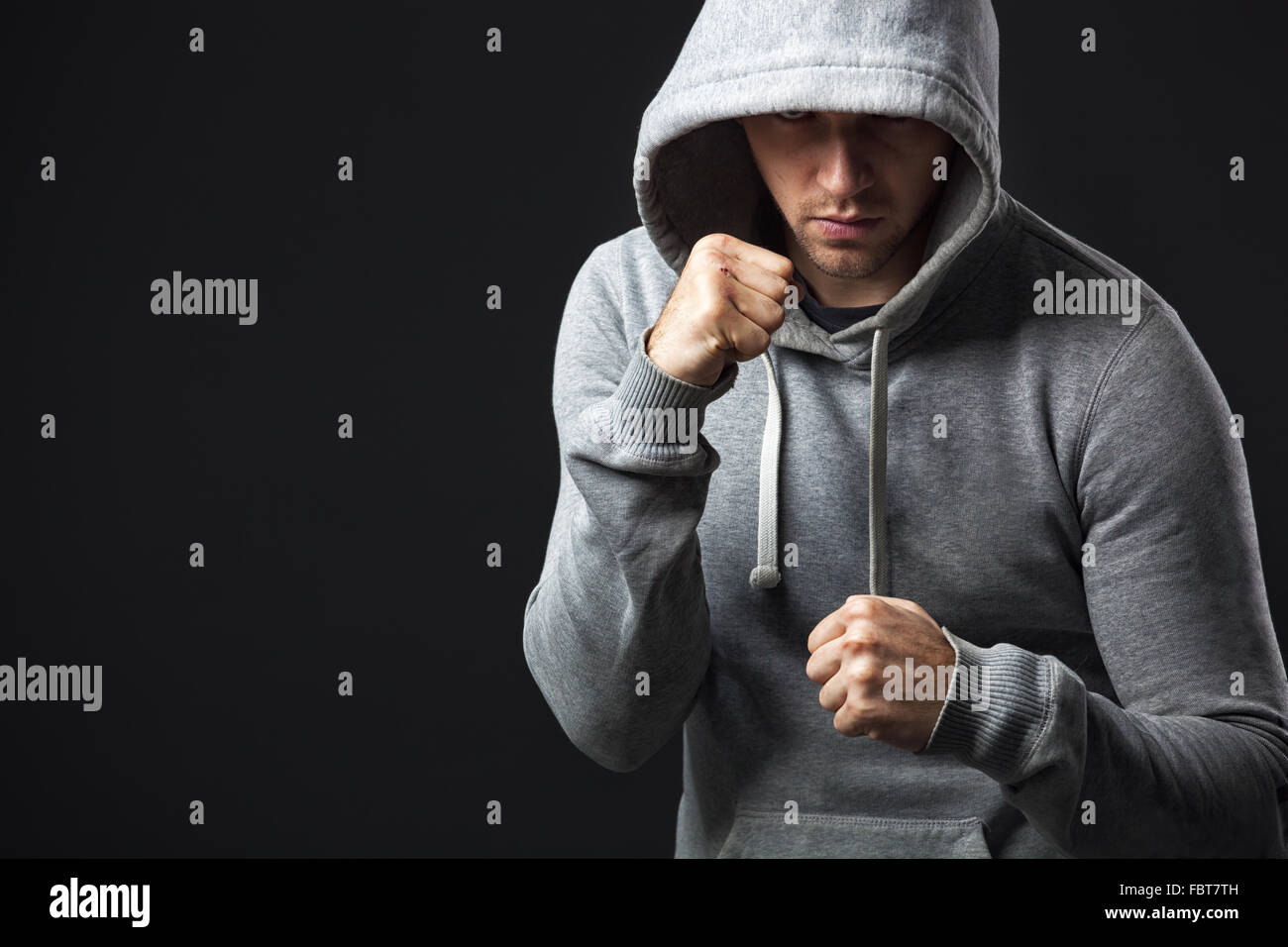 Studio portrait of brutal looking young guy ready to fight Stock Photo ...
