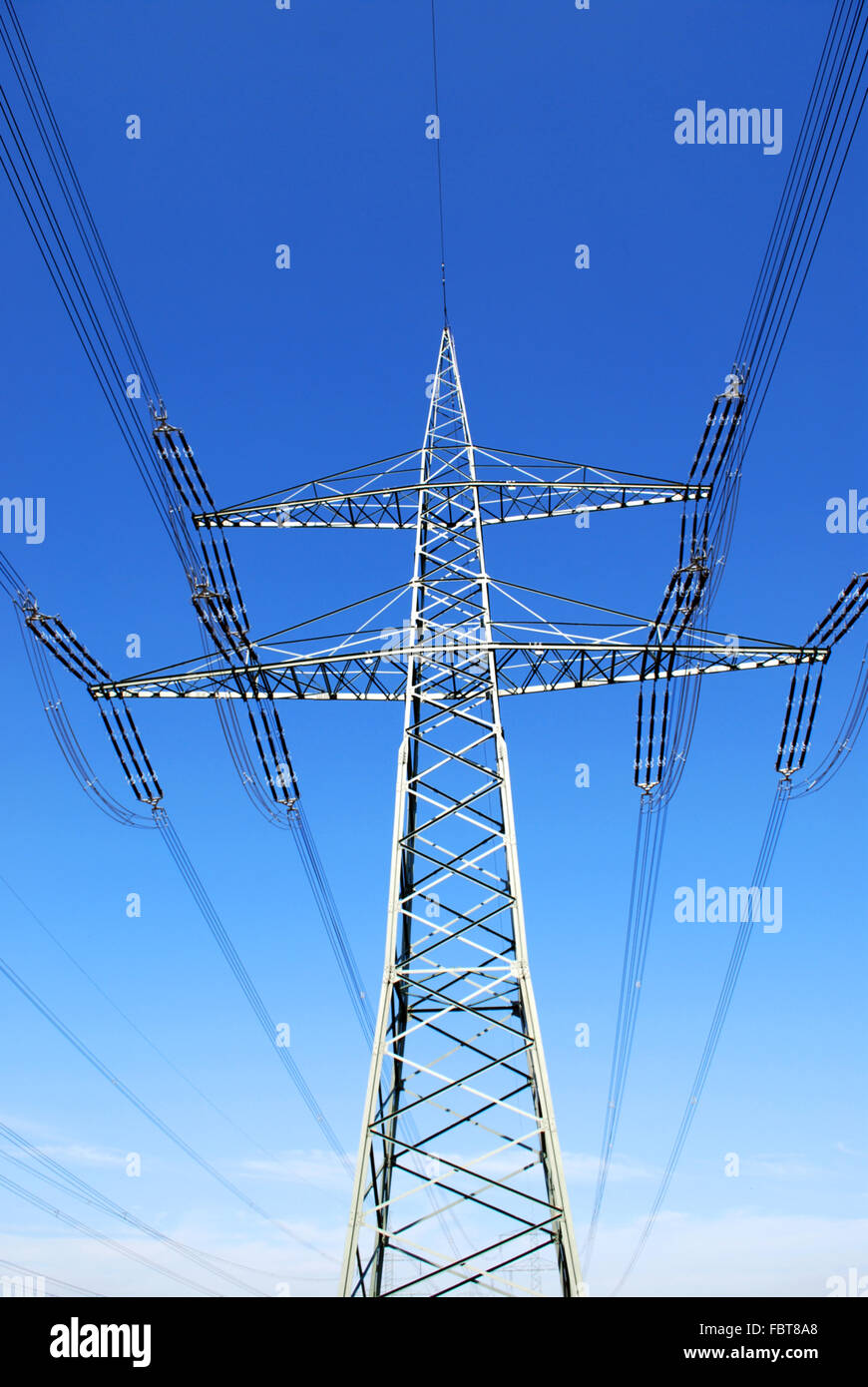 pylon in front of deep blue sky Stock Photo - Alamy