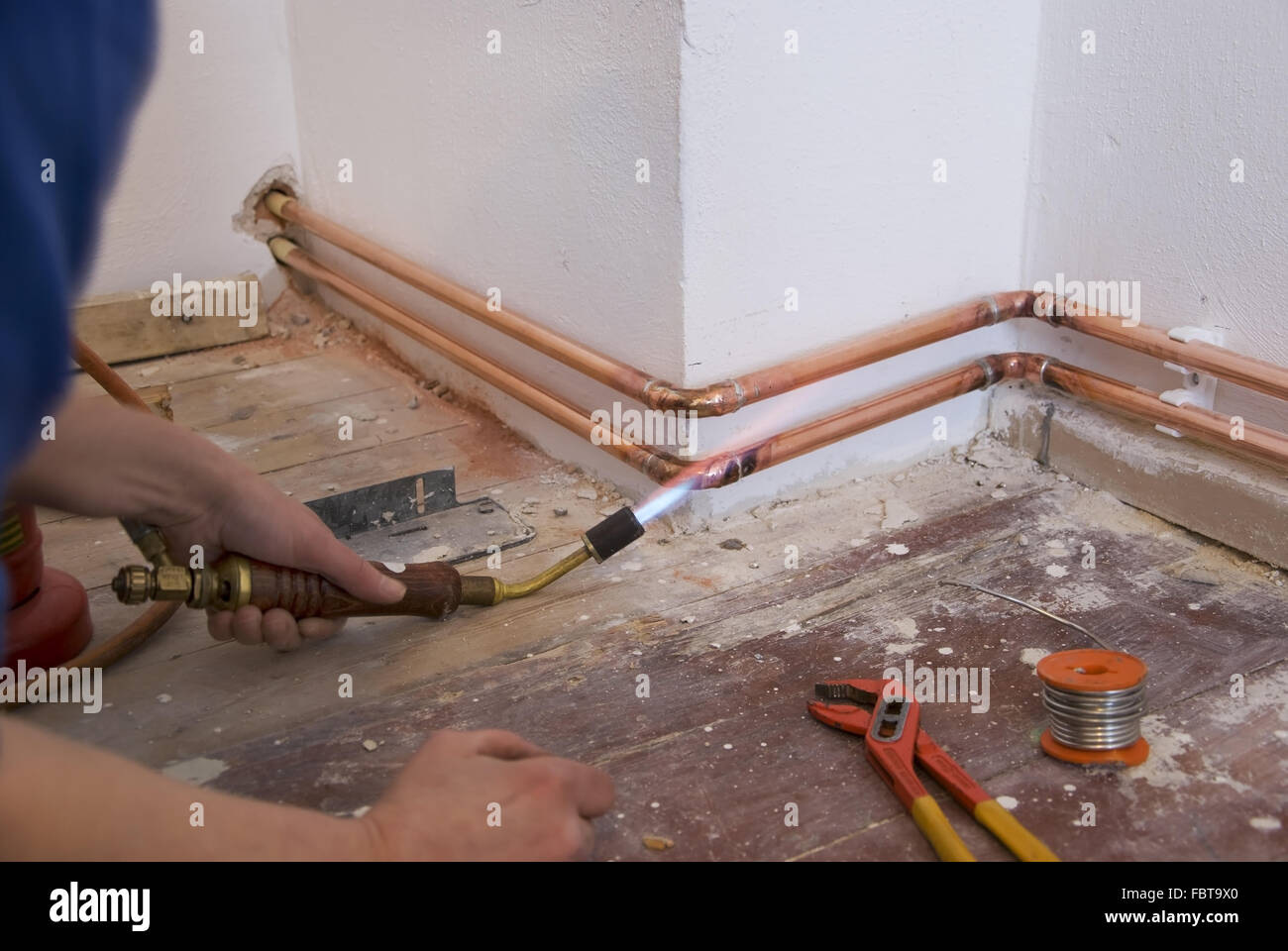 Plumber welding copper pipes hi-res stock photography and images - Alamy