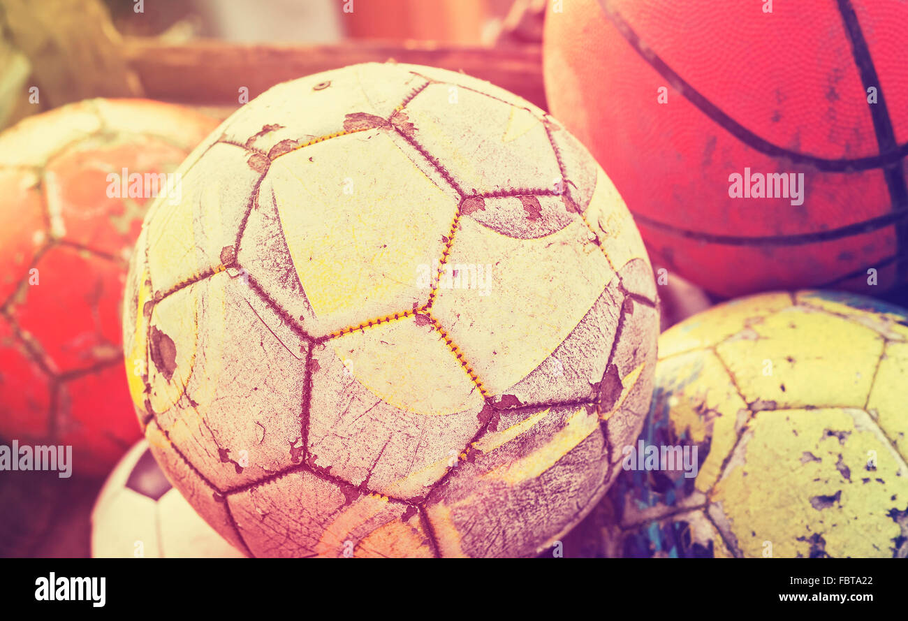 Vintage old film stylized used balls in a basket, shallow depth of ...