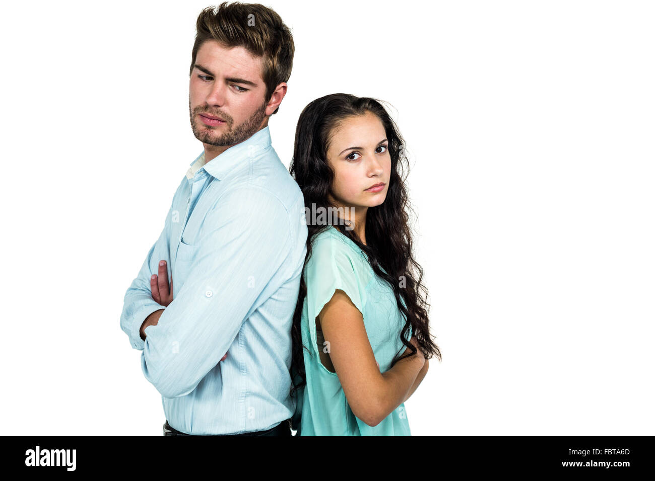 Couple back to back not talking after argument Stock Photo - Alamy