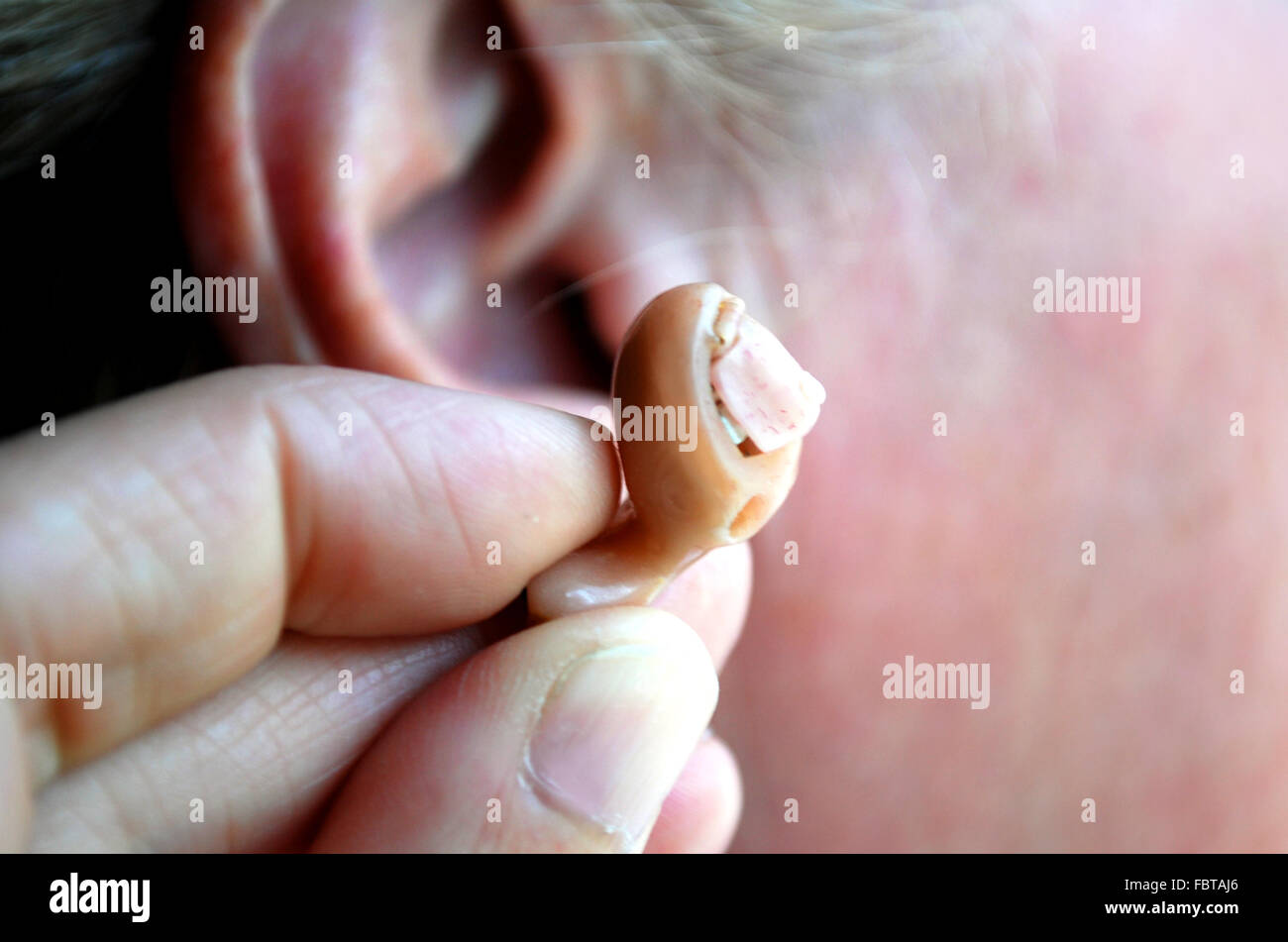 Hearing aid hi-res stock photography and images - Alamy