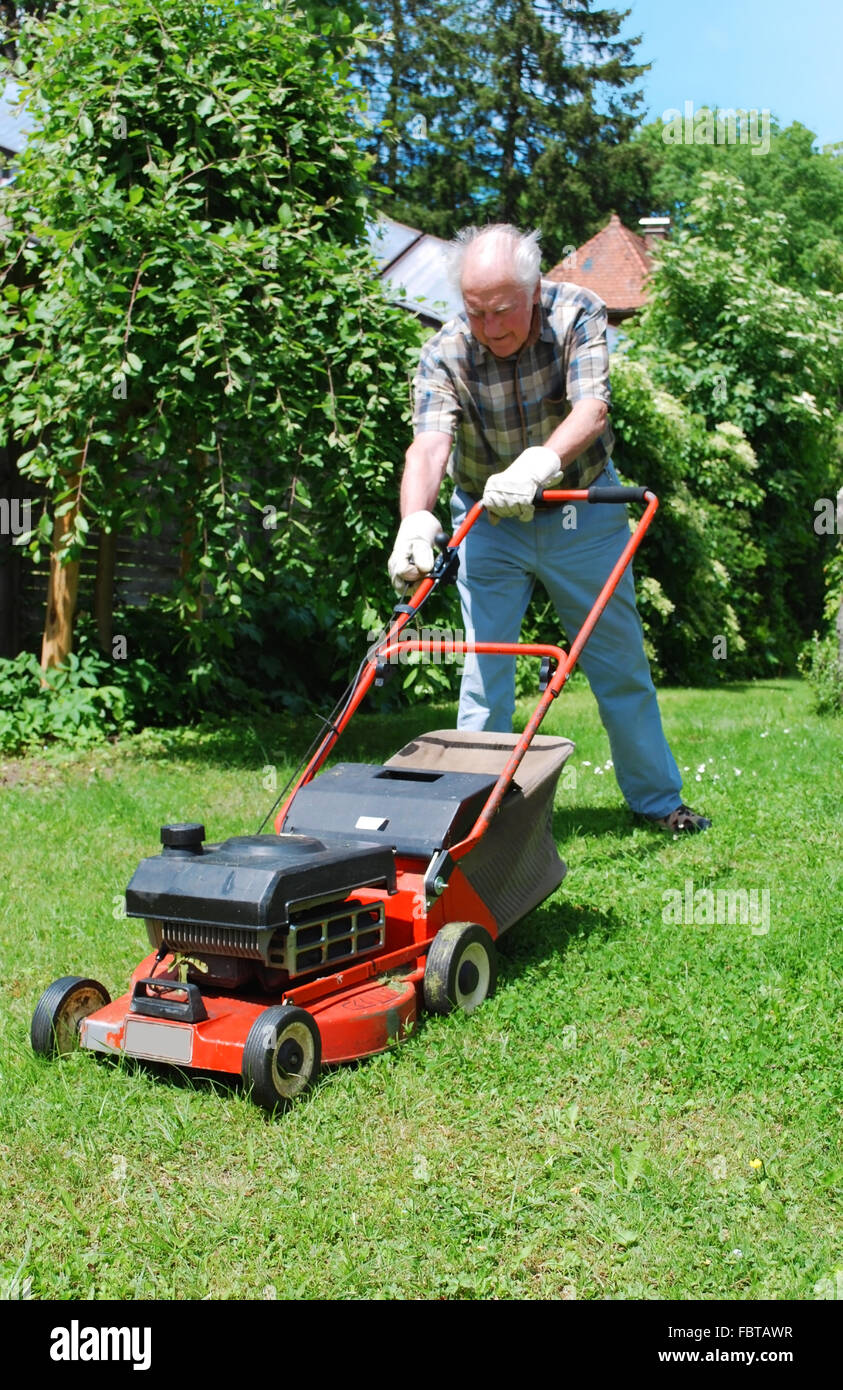 man with lawn mower Stock Photo - Alamy
