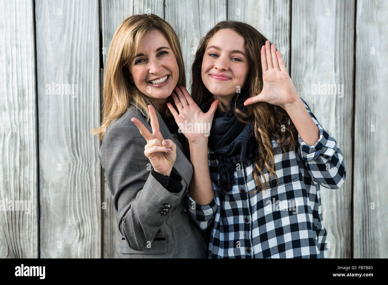 Mother and daughter doing signs Stock Photo - Alamy