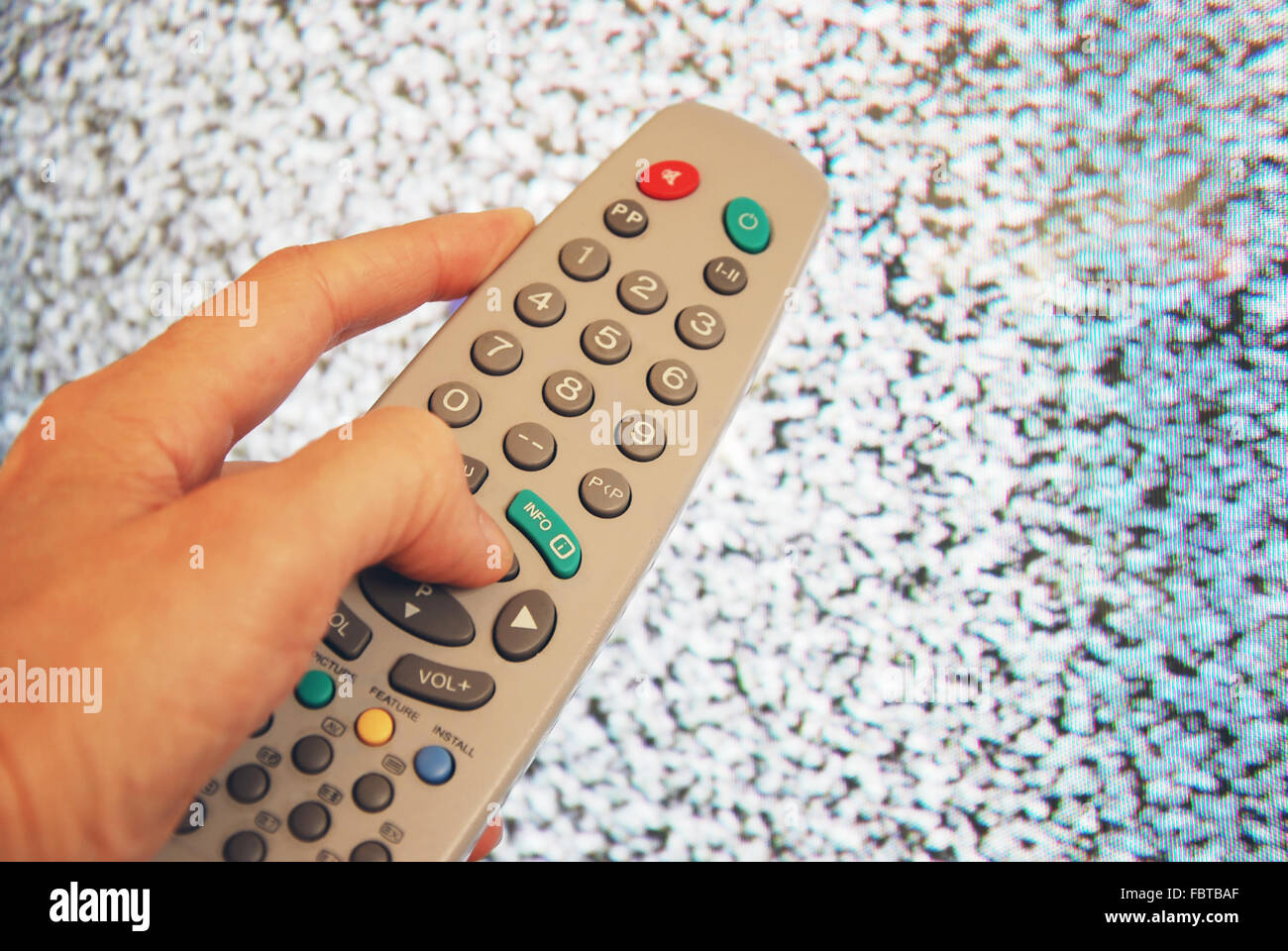hand and remote control Stock Photo - Alamy