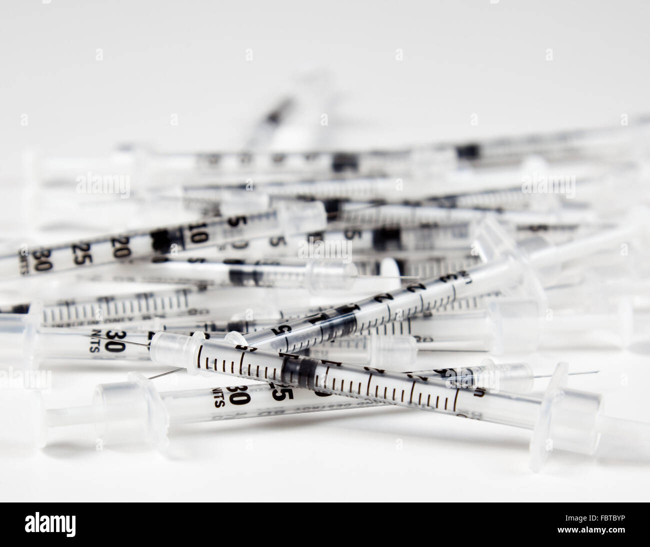 Pile of discarded injection syringes after immunization Stock Photo - Alamy