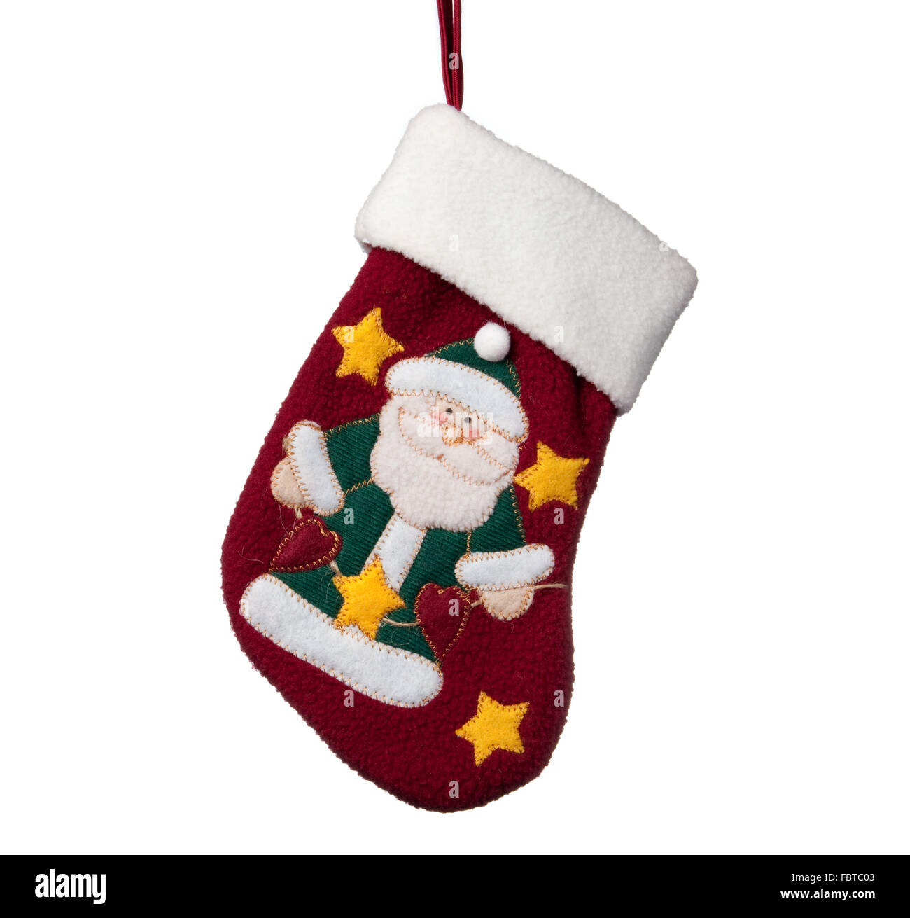 Close up of child's christmas stocking isolated against a white ...