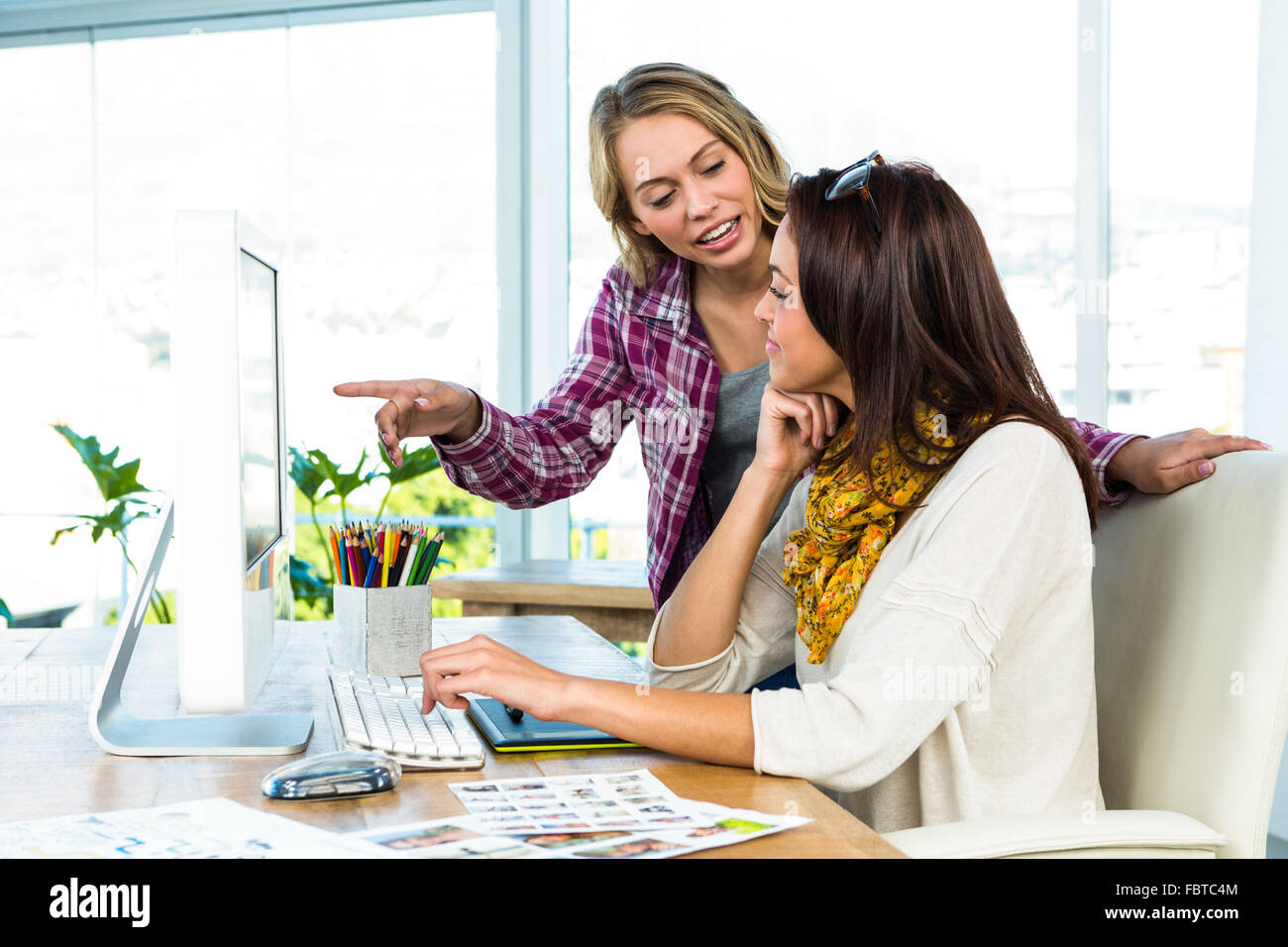 Two girls using computer hi-res stock photography and images - Alamy