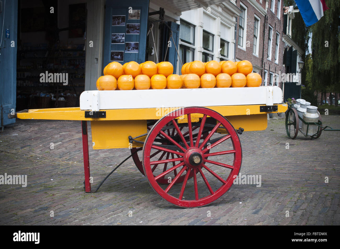 Cart in front of a market full of cheese Stock Photo - Alamy