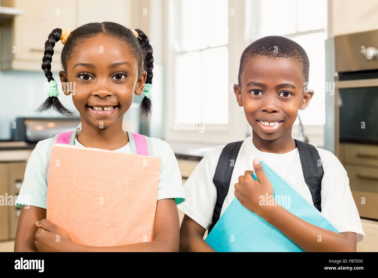 Cute siblings ready for school Stock Photo - Alamy