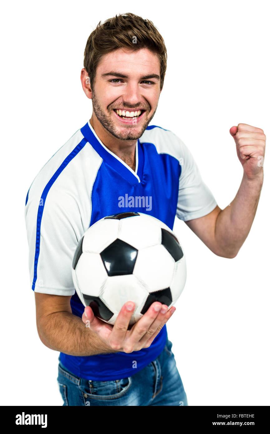 Portrait of smiling man holding football Stock Photo - Alamy