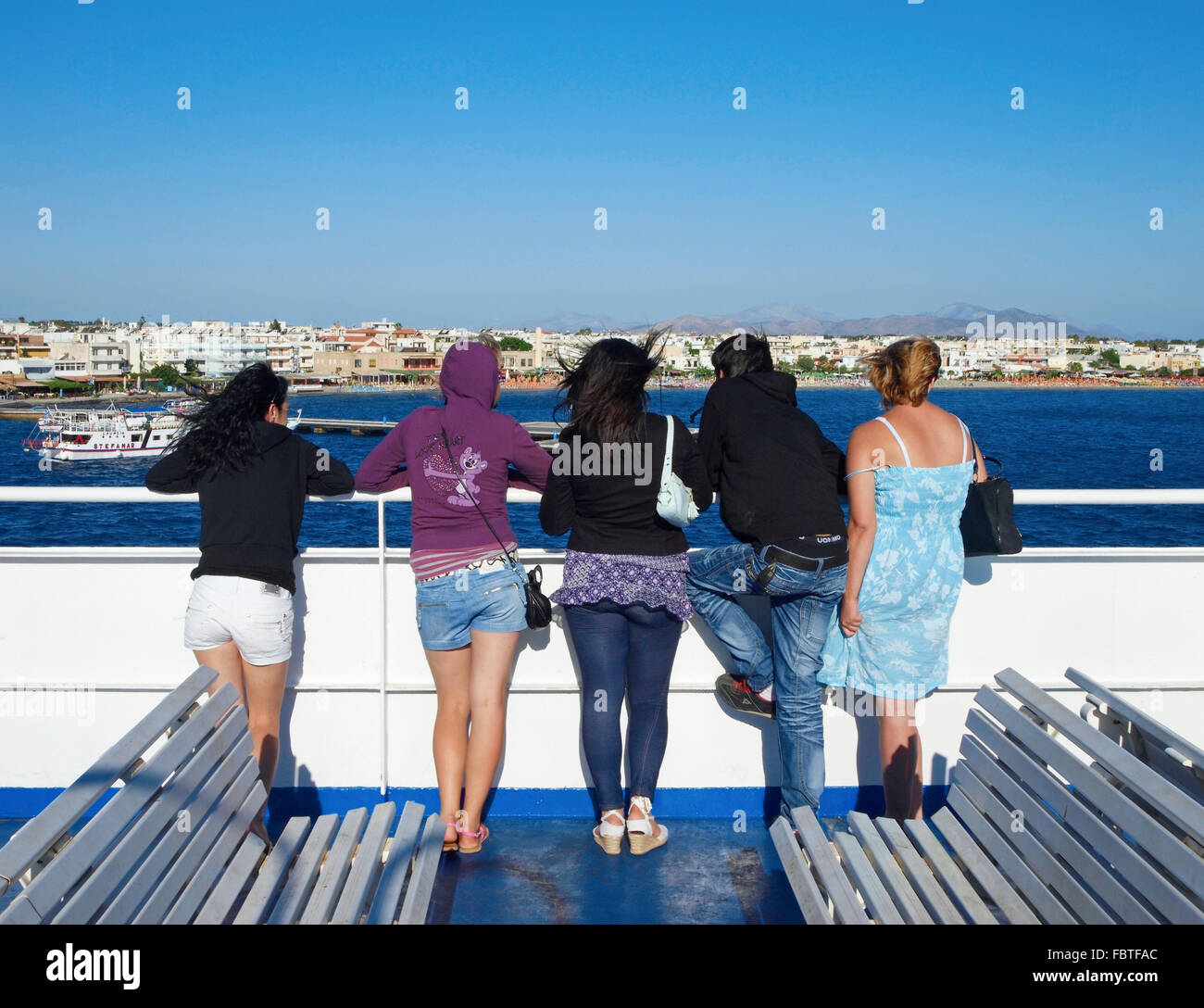 girls on ferryboat and Kos town, Kos Island, Greece Stock Photo - Alamy