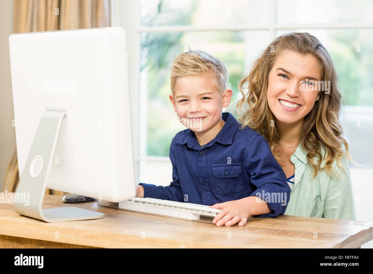 Mother and son using the computer Stock Photo - Alamy