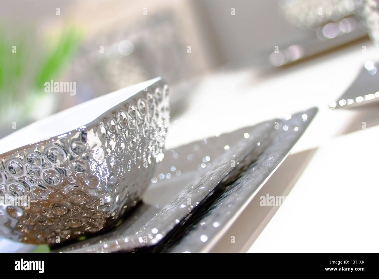 Silver tea cup Stock Photo - Alamy