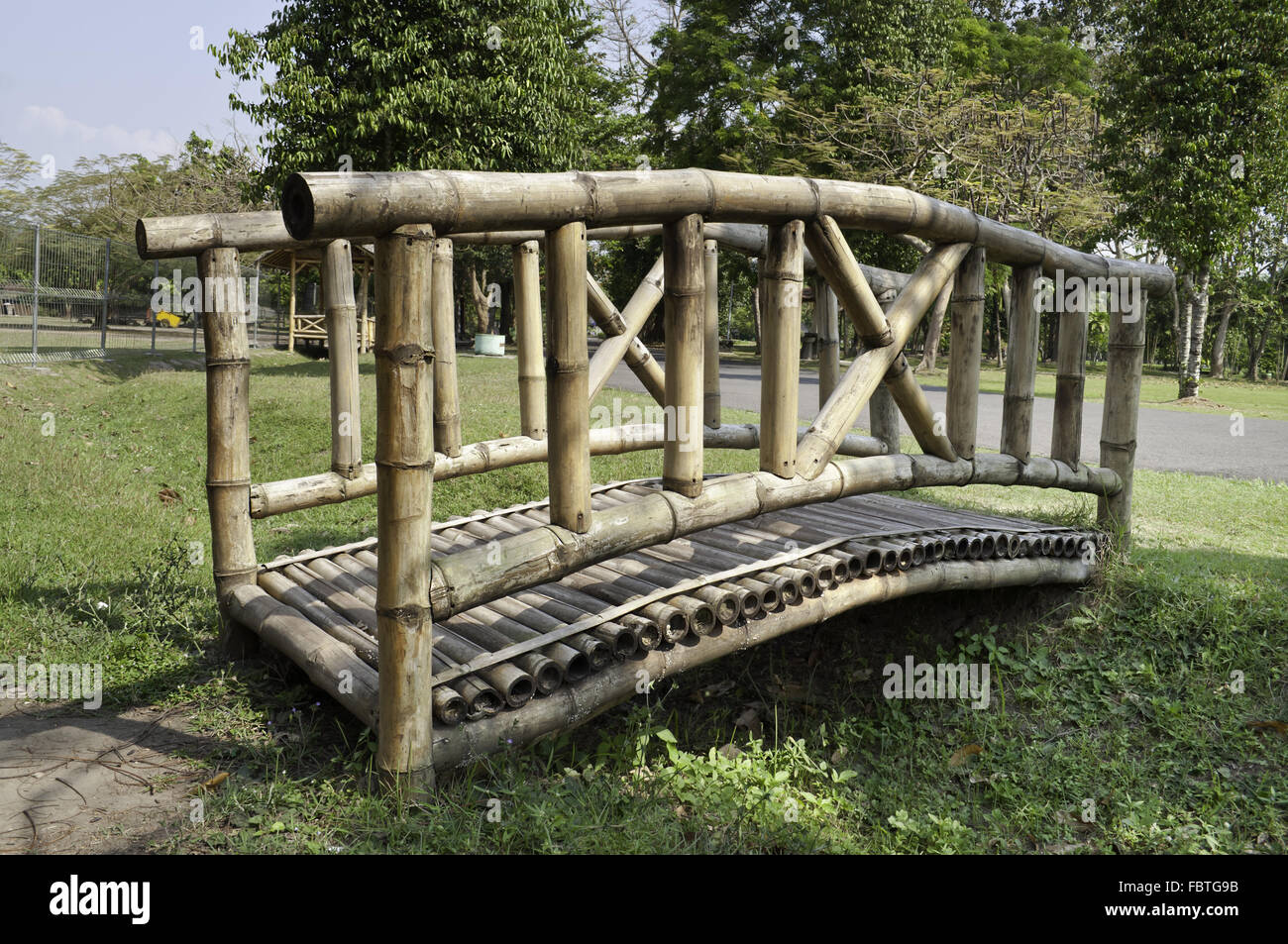 Wooden Bamboo bridge in a public garden Stock Photo - Alamy