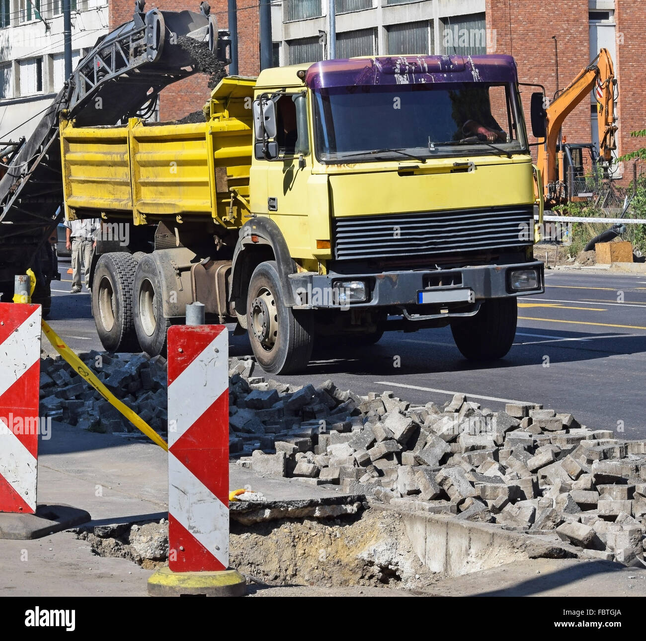 Truck and road scraper machinery at the road construction Stock Photo ...