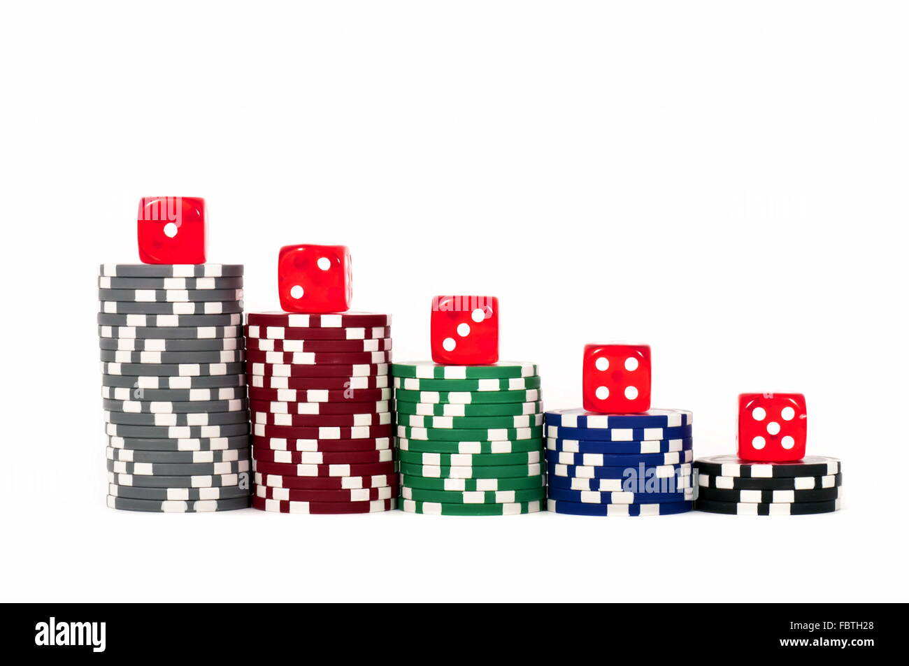 Piled poker chips with dice Stock Photo - Alamy