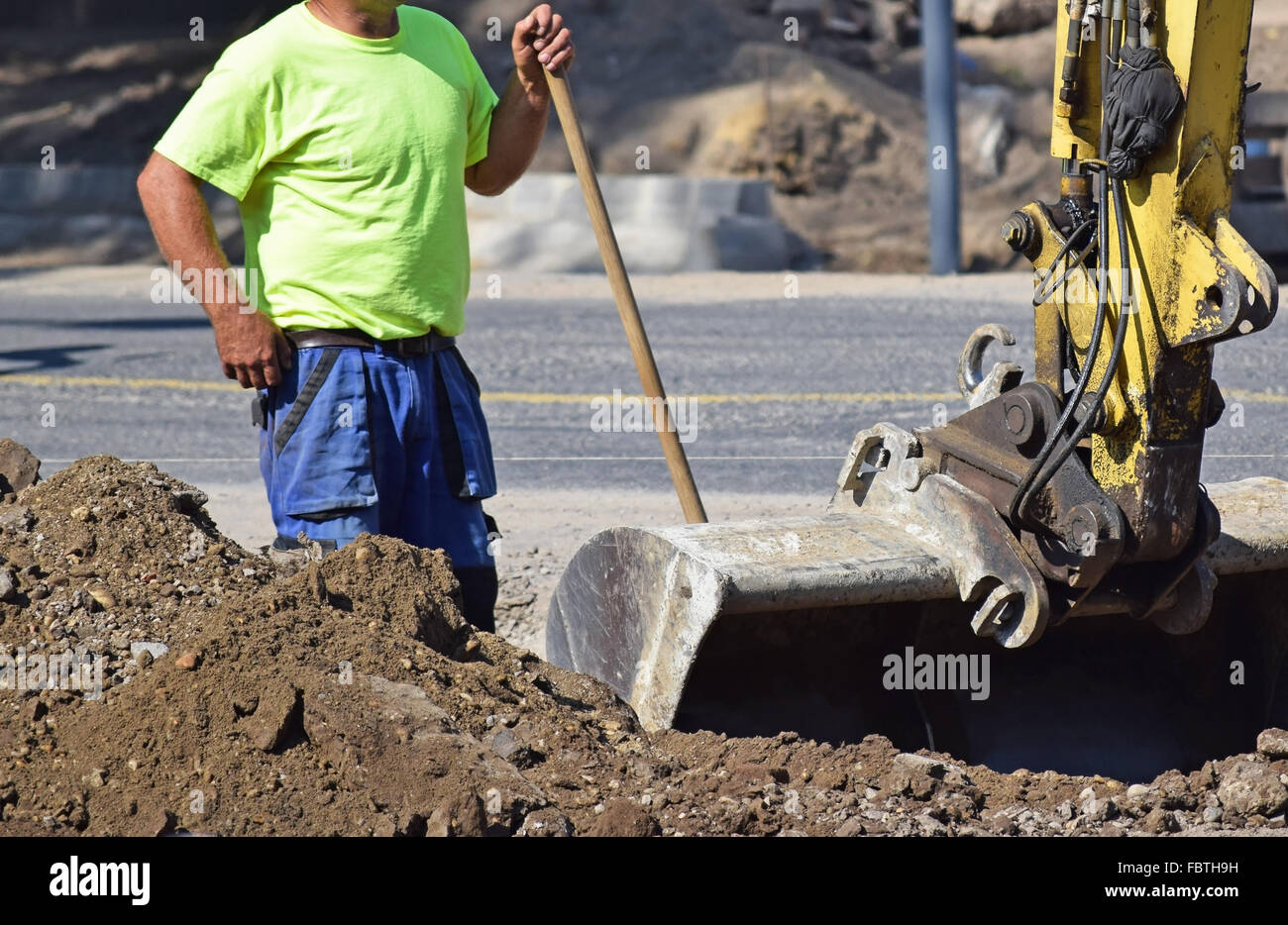 Construction worker at the road construction in the city Stock Photo ...