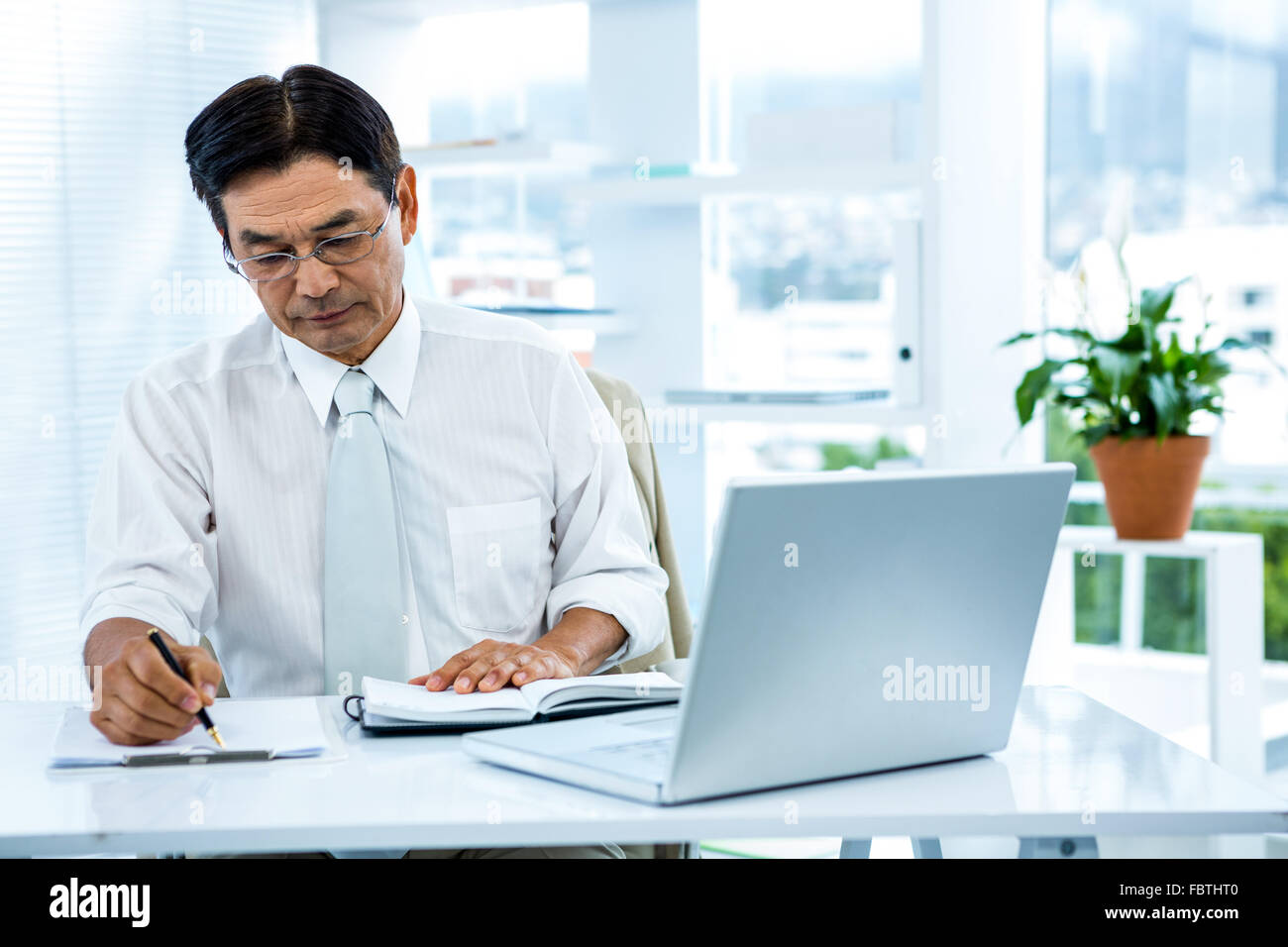 Senior businessman computer writing hi-res stock photography and images ...