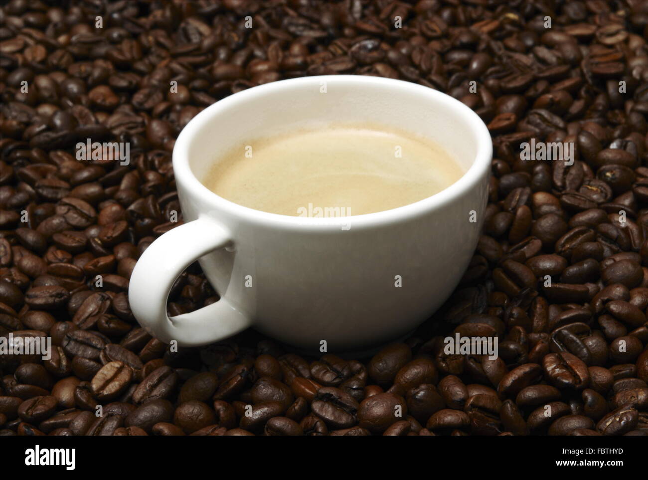 Coffee Cup in Coffee beans Stock Photo - Alamy