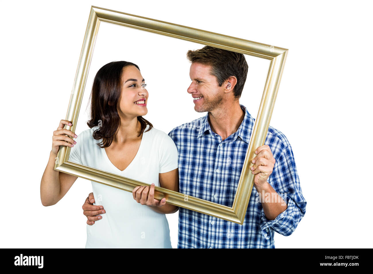 Couple holding picture frame Stock Photo - Alamy
