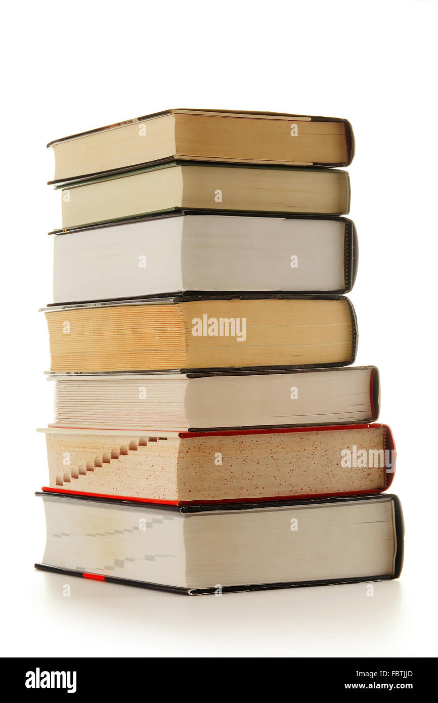 Stack of books on the table isolated on white Stock Photo - Alamy