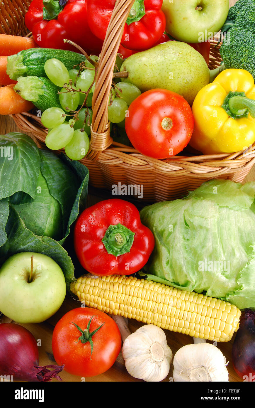 Composition with raw vegetables and wicker basket Stock Photo - Alamy