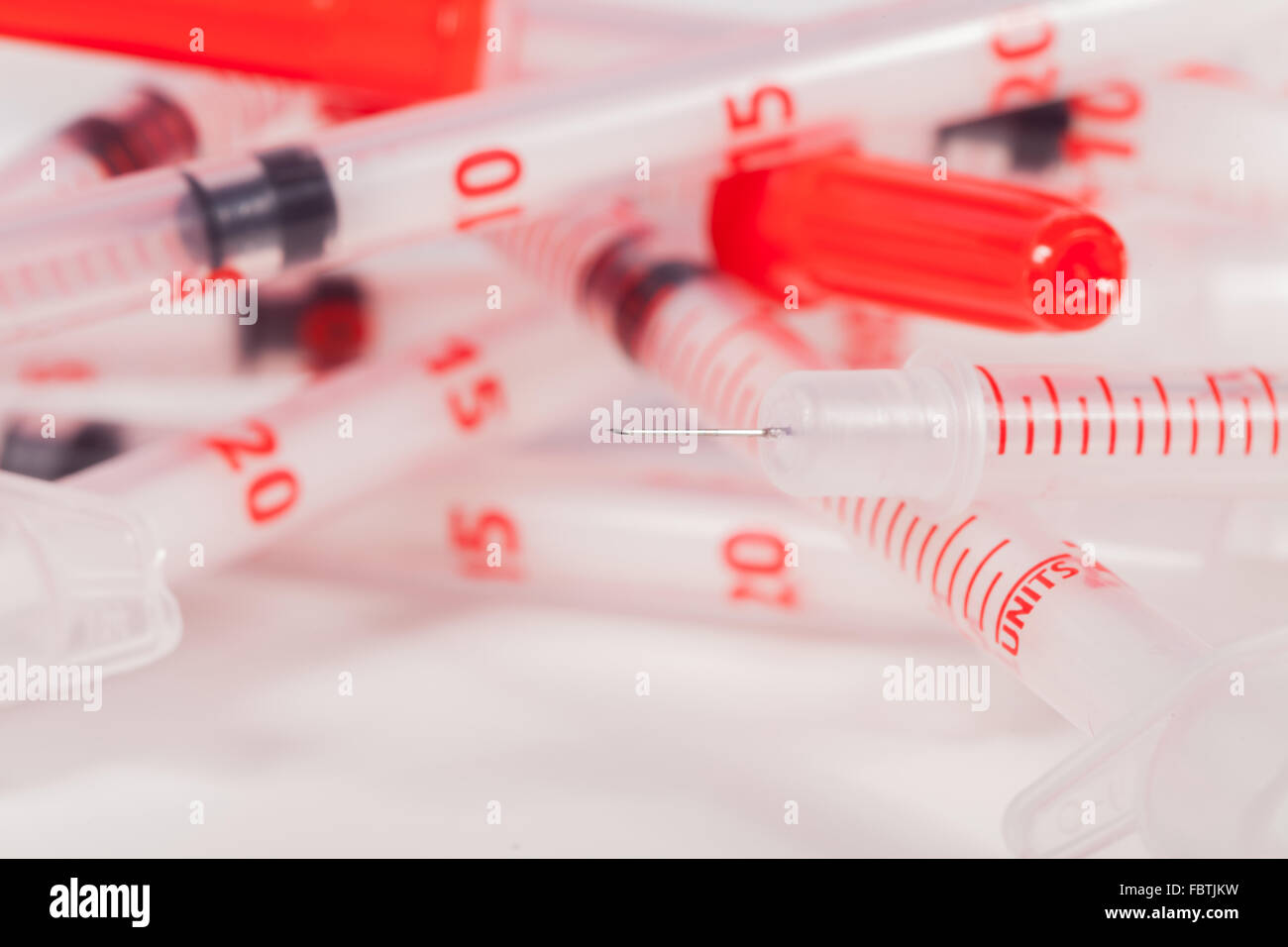 Still Life Close Up of Pile of Empty Syringe Needles with Red Safety ...
