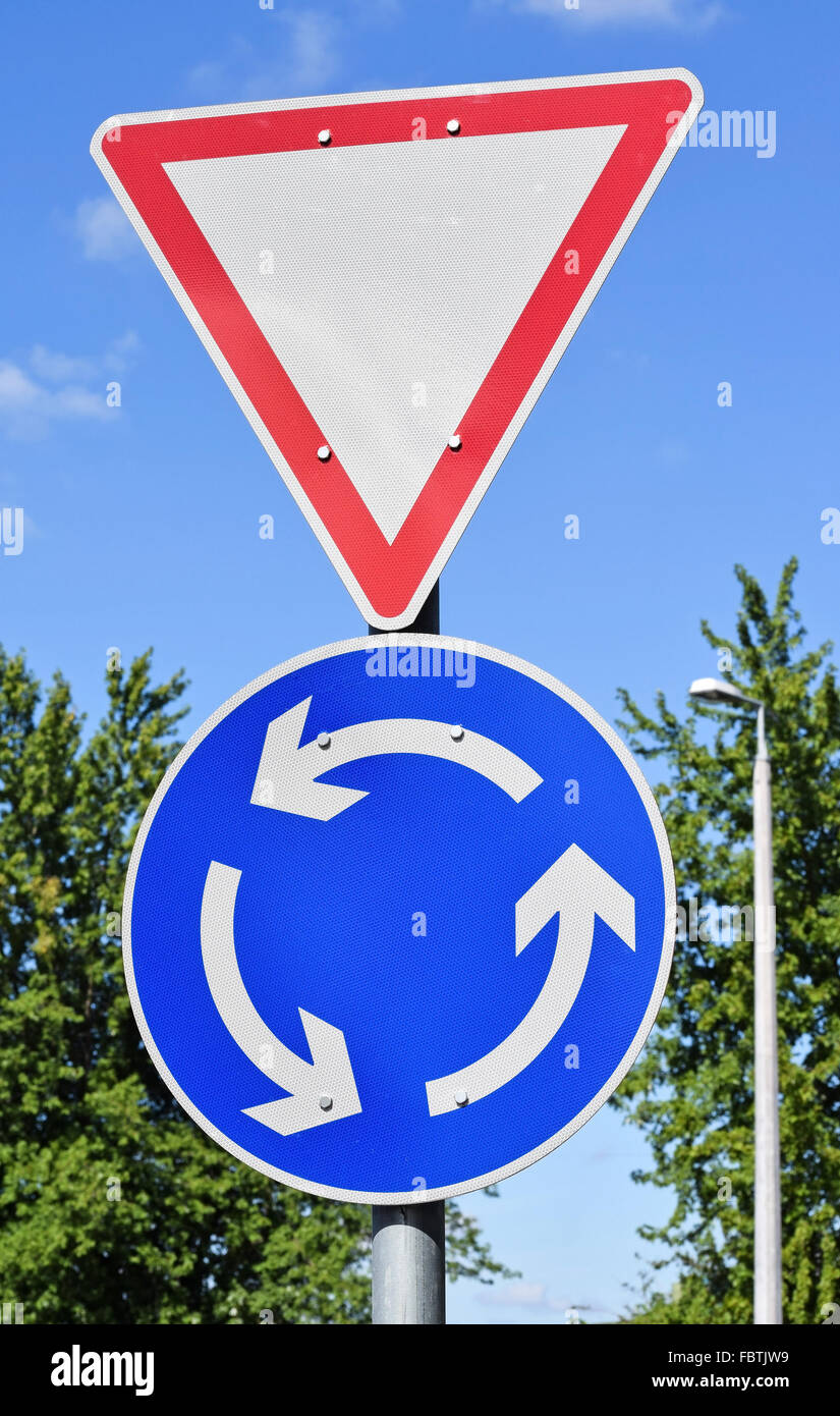 Yield and roundabout traffic signs Stock Photo - Alamy